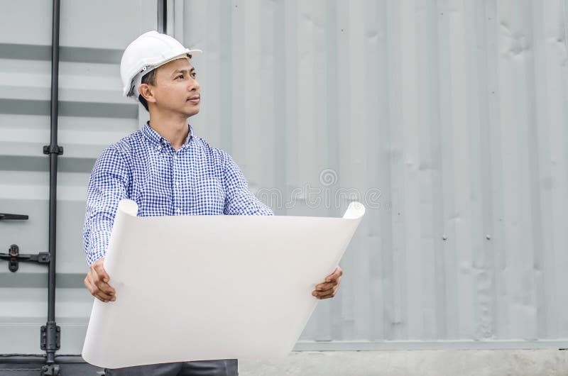 Engineer Man with Helmet Looking Paper Plans at Construction Site ...