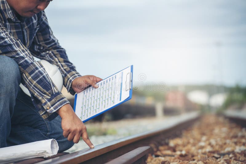 Asian Engineer Men Fill Out Form or Inspect in Front of Construction ...
