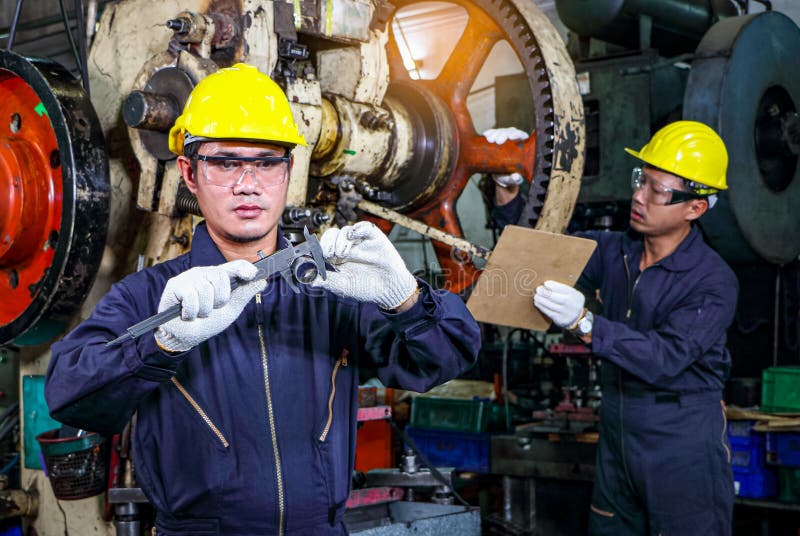 Asian Engineer Safety Uniforms Use Vernier Calipers To Measure ...