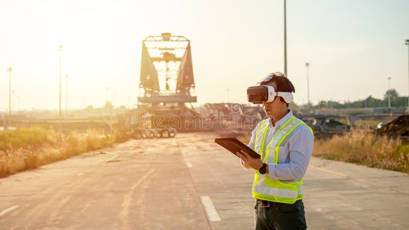 Asian Engineer Using Virtual Reality Headset and Tablet for Inspecting ...