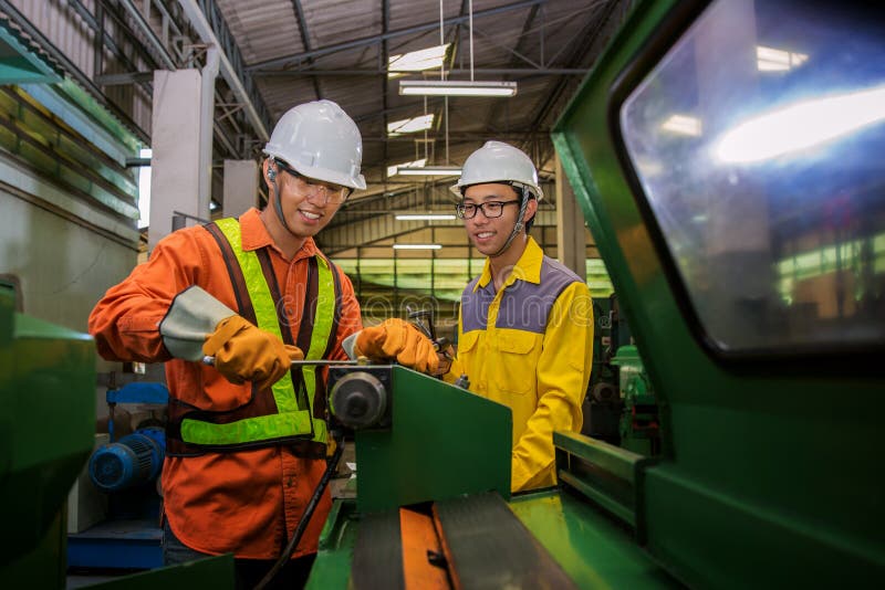 Asian Engineer and Worker Setting Machine for Process Metal Job ...
