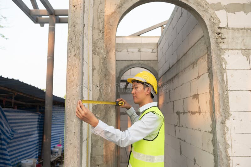 Asian Engineering Man Wearing Safety Helmet Checking Construction Site ...