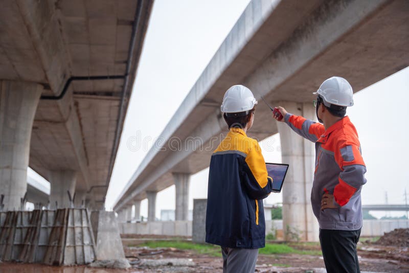 Asian Engineering Team Conducting an Inspection at a Highway ...