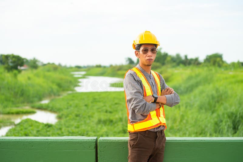 Asian Engineers Wearing Hard Hat and Safety Vest Can Also Use Their ...