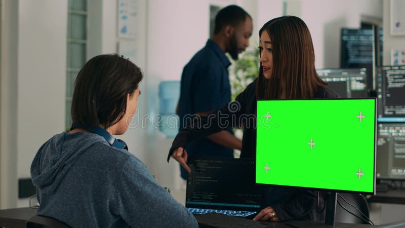 Asian It Engineers Analyzing Greenscreen On Computer And Coding