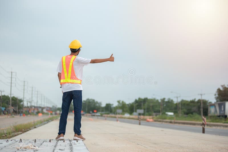 Asian Engineers Standing with Their Thumbs Up May Be Assessing the ...