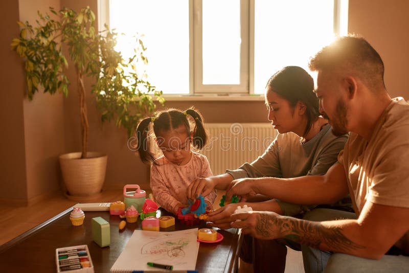 Asian Family Disassembling Toy Cube with Figures Stock Image - Image of ...