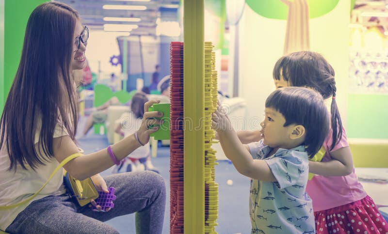 Asian Family is Having Fun in Playground Stock Photo - Image of smiling ...