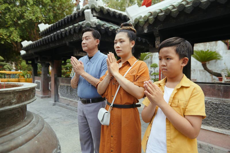 Asian Family Praying Together Outdoors Stock Photo - Image of ...
