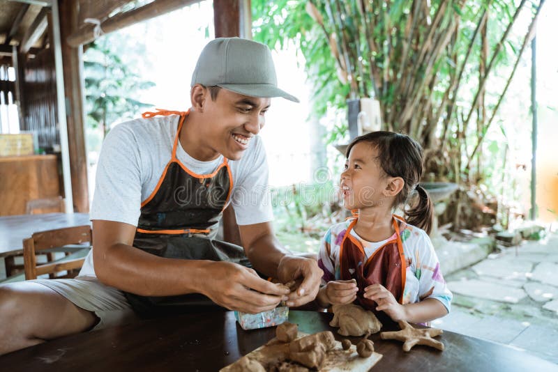 Asian Father and Daughter Working with Clay Stock Photo - Image of ...