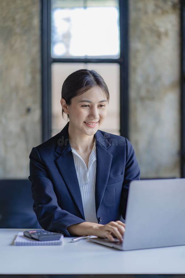 Asian Female Accountant Doing Calculations Analyzing Reports Pointing ...