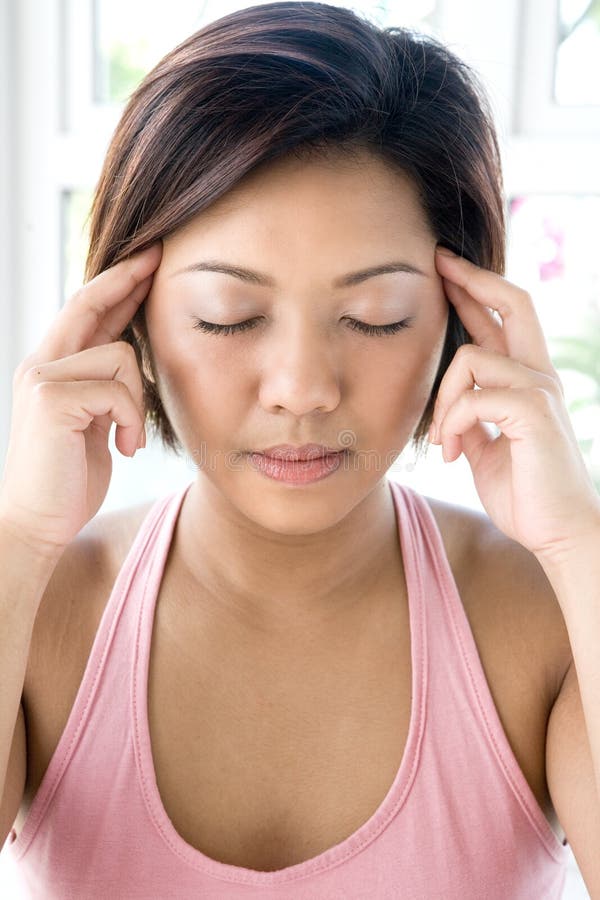 Asian Female Applying Gentle Pressure on Temple Stock Photo - Image of ...