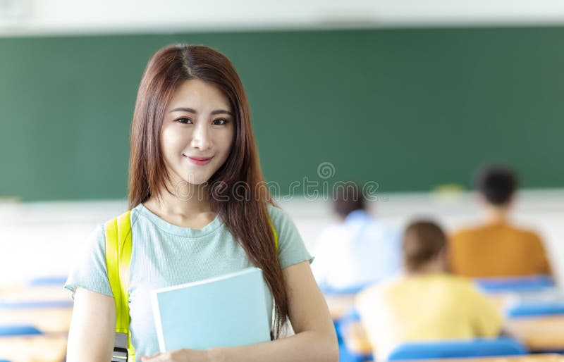 Female College Student in Classroom Stock Image - Image of smiling ...