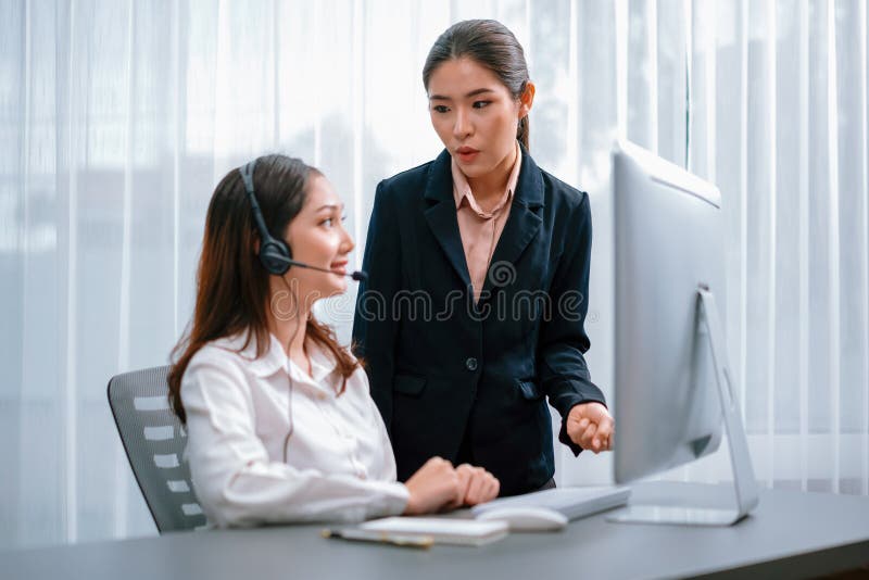 Asian Female Customer Support Operator Guided by Manger Enthusiastic ...