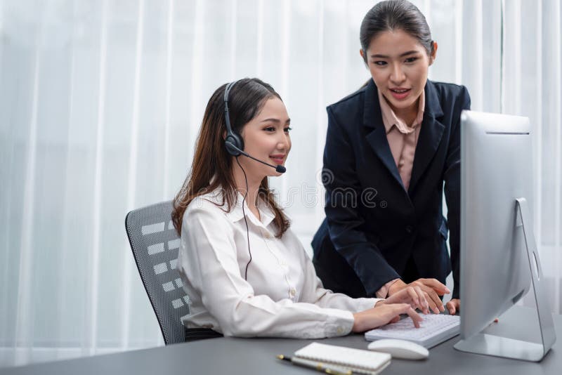 Asian Female Customer Support Operator Guided by Manger Enthusiastic ...