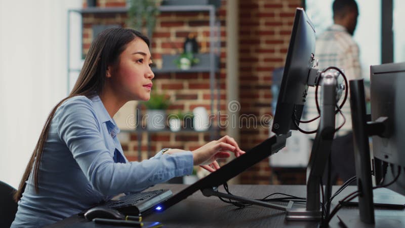 Asian Female Engineer Using Touchscreen Display To Create Game ...