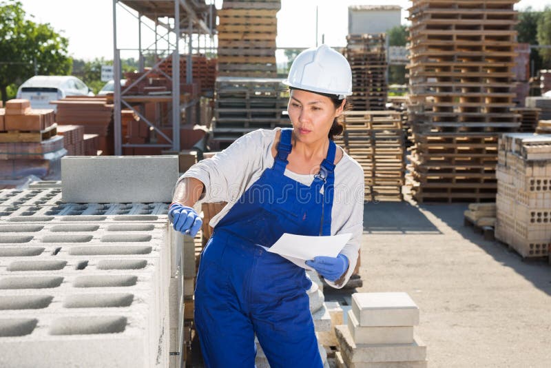 Asian Female Manager Keeps Records of Brick in the Open Area of ...
