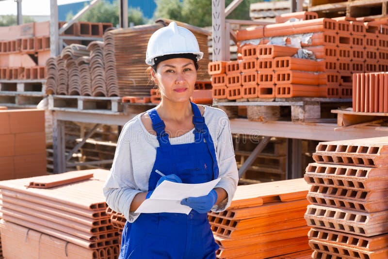 Asian Female Manager Keeps Records of Brick in the Open Area of ...