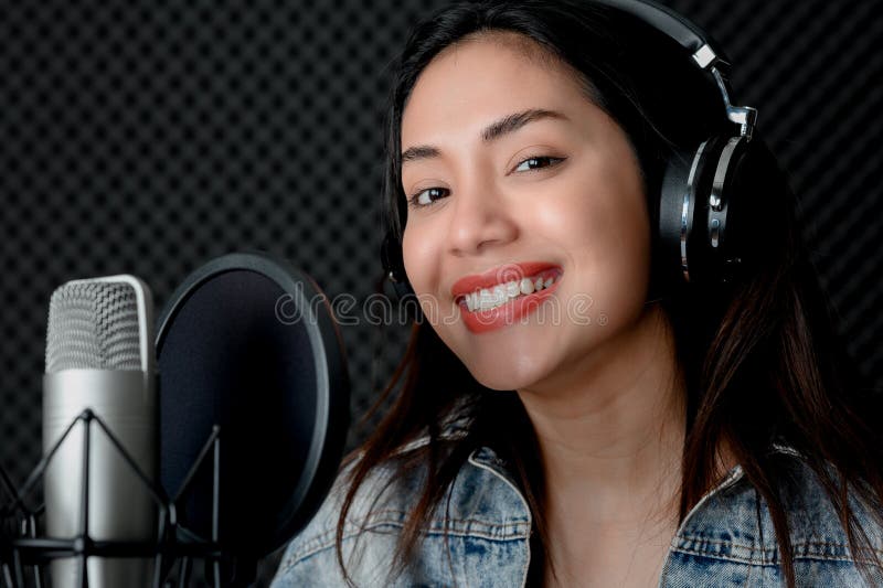 Asian Female Singer Singing in a Recording Studio. Female Singer ...