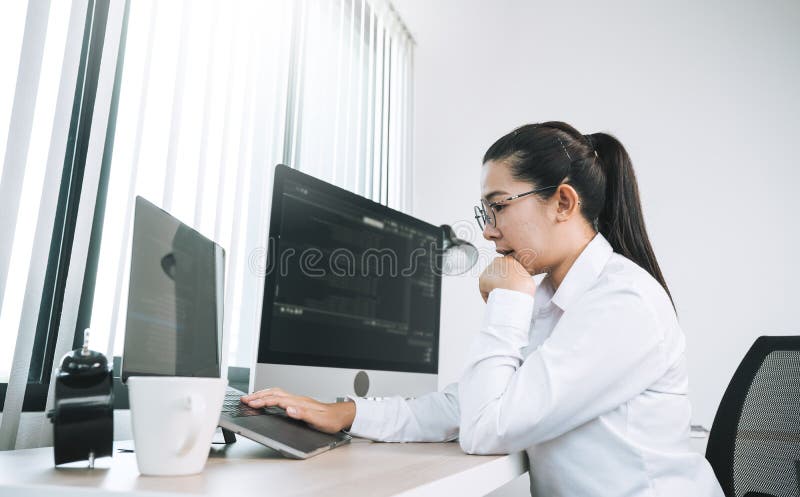 Asian Female Software Developer is Worried about Analyzing Code-based ... Asian Female Software Developer is Worried about Analyzing Code-based ...