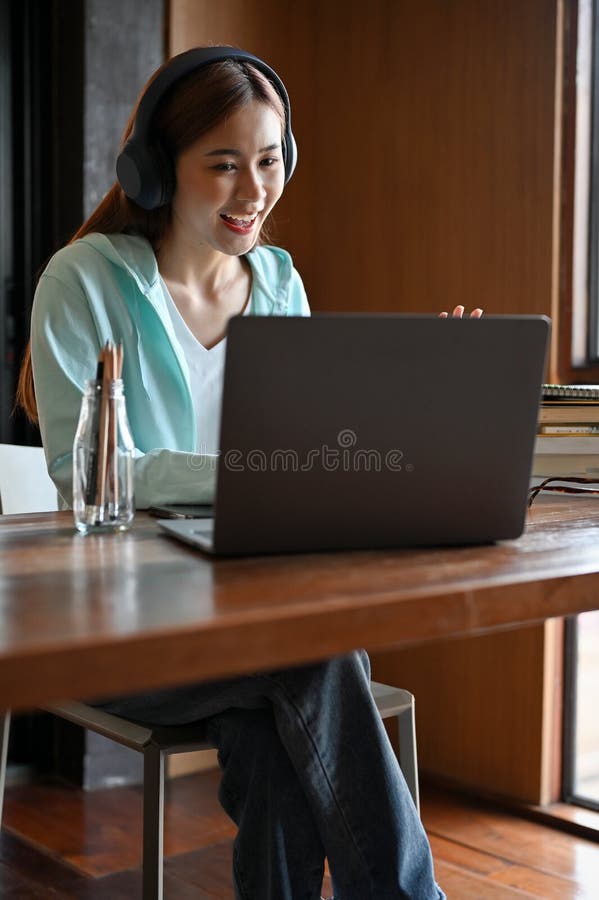 Asian Female Student Having an Online Class or E-learning Lesson in ...