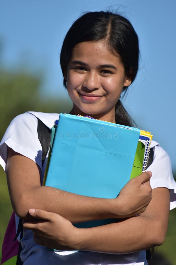 An Asian Female Student Holding Books Stock Image - Image of text ...