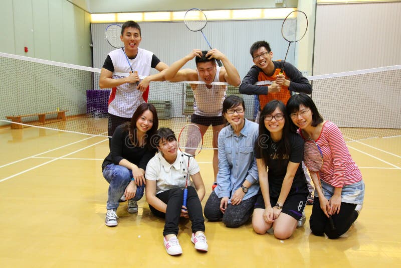 Asian Friends Playing Badminton Stock Image - Image of people, looking ...