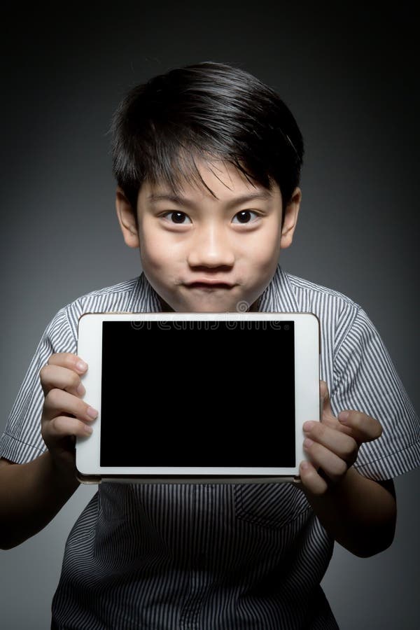 Kids Holding Tablet Computer Over Red and Light Blue Background Stock ...