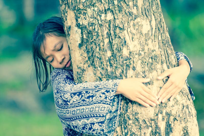 Asian girl hugging tree stock photo. Image of embrace - 101527140