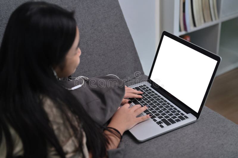 Girl Lying on Comfortable Sofa and Using Laptop Computer. Stock Image ...