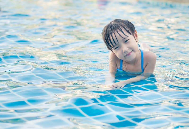 Asian Girl is Playing in the Pool Stock Image - Image of blue, active ...
