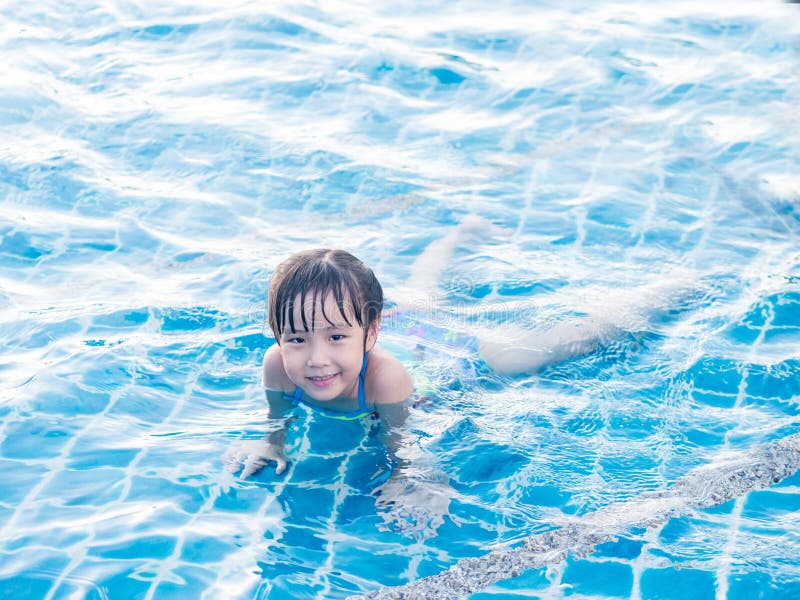 Asian Girl is Playing in the Pool Stock Image - Image of little, face ...