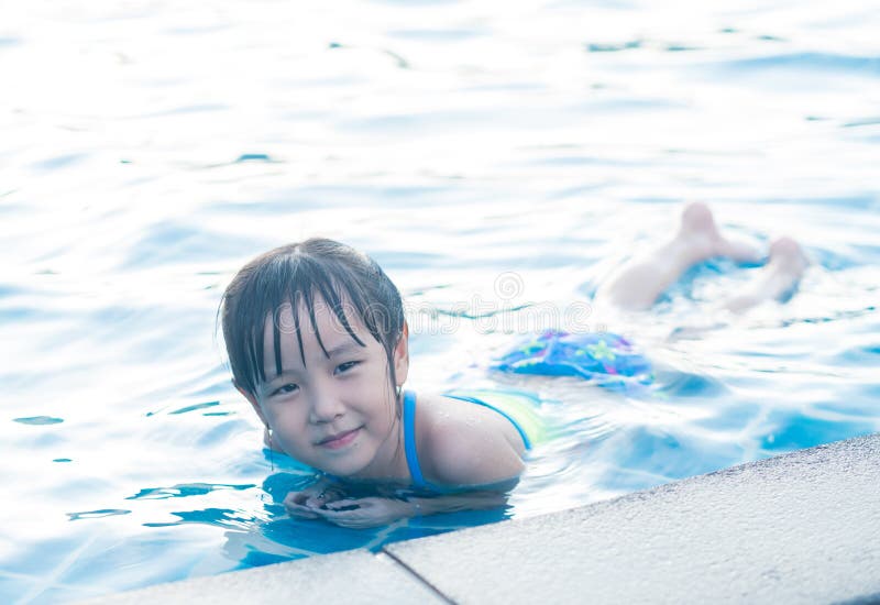 Asian Girl is Playing in the Pool Stock Photo - Image of look, outdoor ...