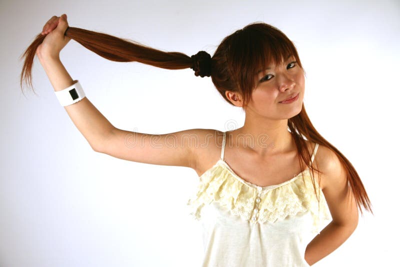 A girl pulling her hair up stock photo. Image of lips - 21323632