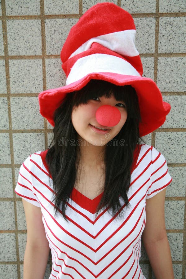 Asian Girl with Red Nose and Hat Stock Photo - Image of smiling ...