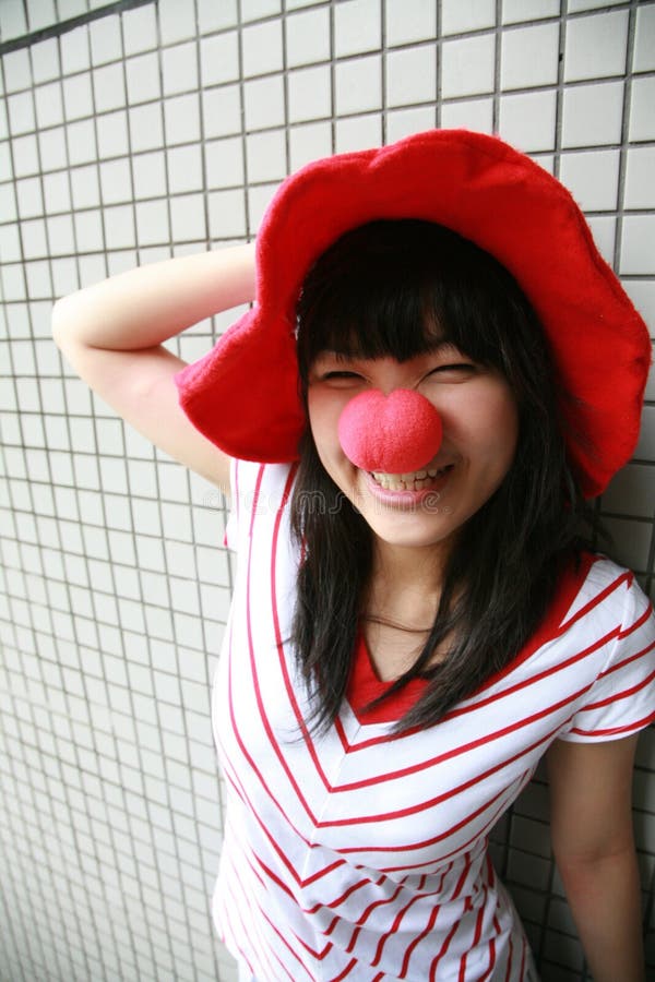 Asian Girl with Red Nose and Hat Stock Image - Image of female, smiles ...