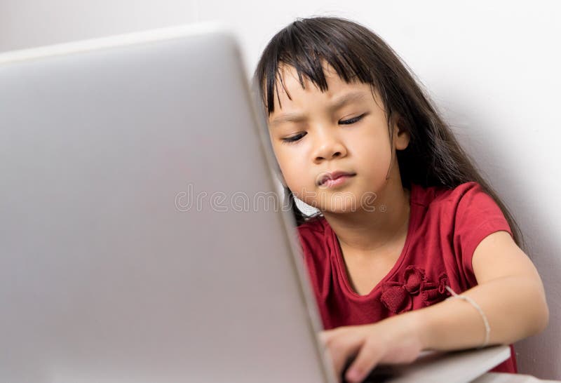 Asian Girl Seriously Working on a Laptop Computer. Stock Photo - Image ...