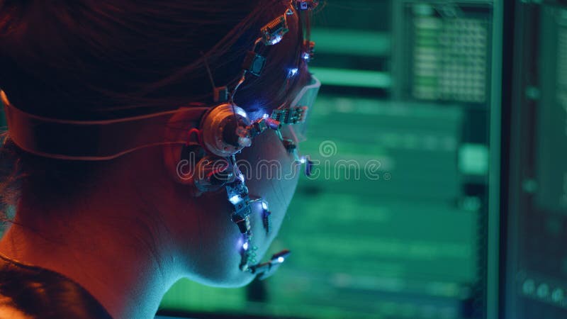 Asian Girl Side View with a Headset Develops Code Using Multiple ...