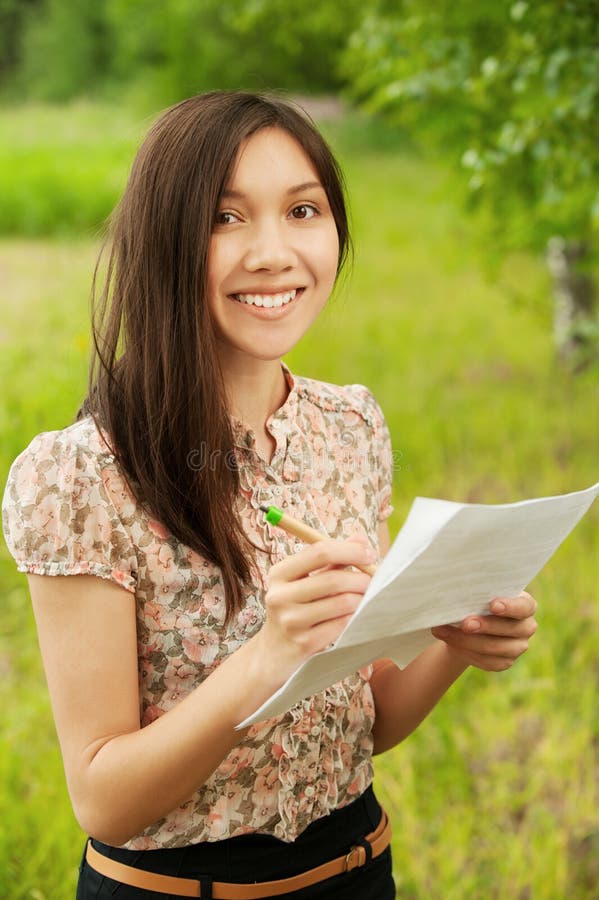 Asian girl taking notes stock photo. Image of outdoors - 23580892