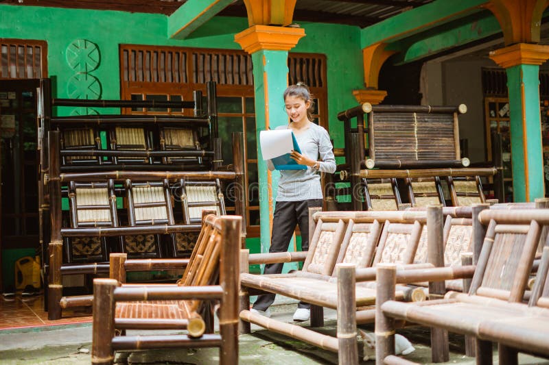 Asian Girl Using a Clipboard To Check the Quantity Stock Image - Image ...