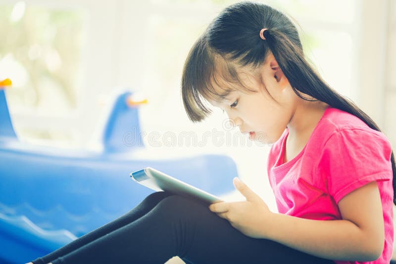 Asian Girl Using Tablet , Early Education and Learning Stock Image ...