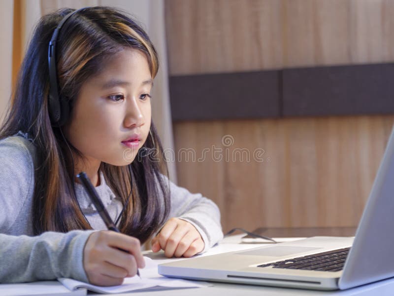 Asian Girls Study Online with Laptops. Kid Wear Headset Typing Keyboard ...