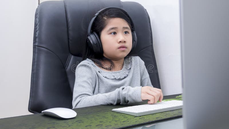 Asian Girls Study Online with Laptops. Kid Wear Headset Typing Keyboard ...