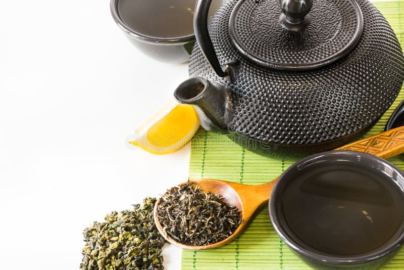 Asian Green Tea Set on Bamboo Mat with Dried Green Tea in Spoon. Asian ...