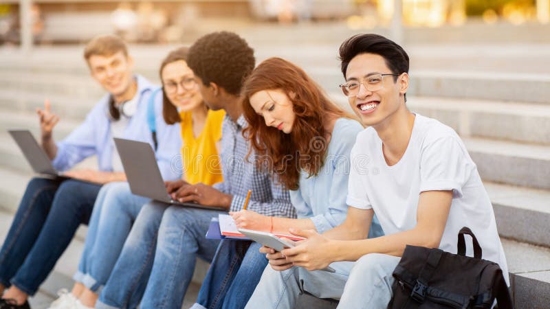 Asian Guy Studying Outdoors with His Friends Stock Photo - Image of ...