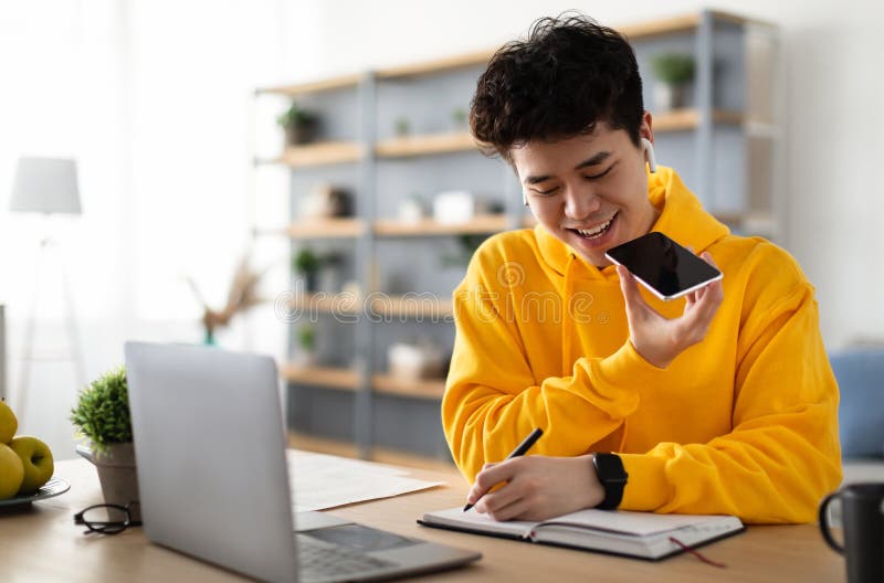Asian Guy Using Voice Assistant on Cellphone Stock Photo - Image of ...