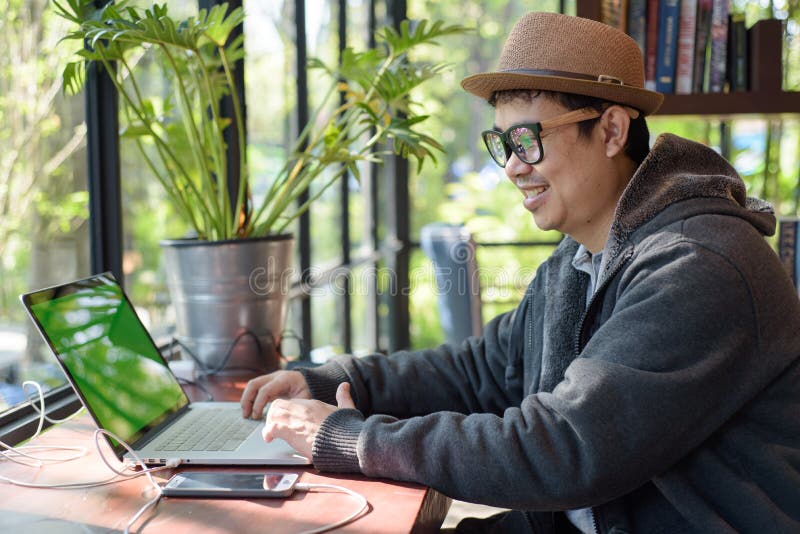 Asian Hacker Using Laptop and Computers in Cafe. Stock Photo - Image of ...