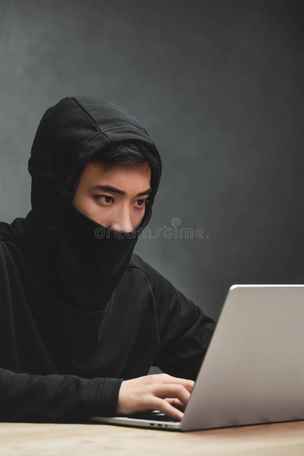 Asian Hacker with Obscured Face Using Stock Photo - Image of gadget ...