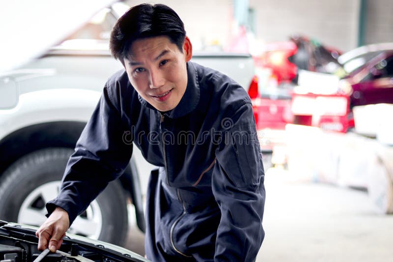 Asian Handsome Mechanic Man in Uniform Working with Engine Vehicle ...