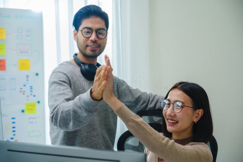 Asian and Indian Developer Team Clapping Hand for Project Success with ...